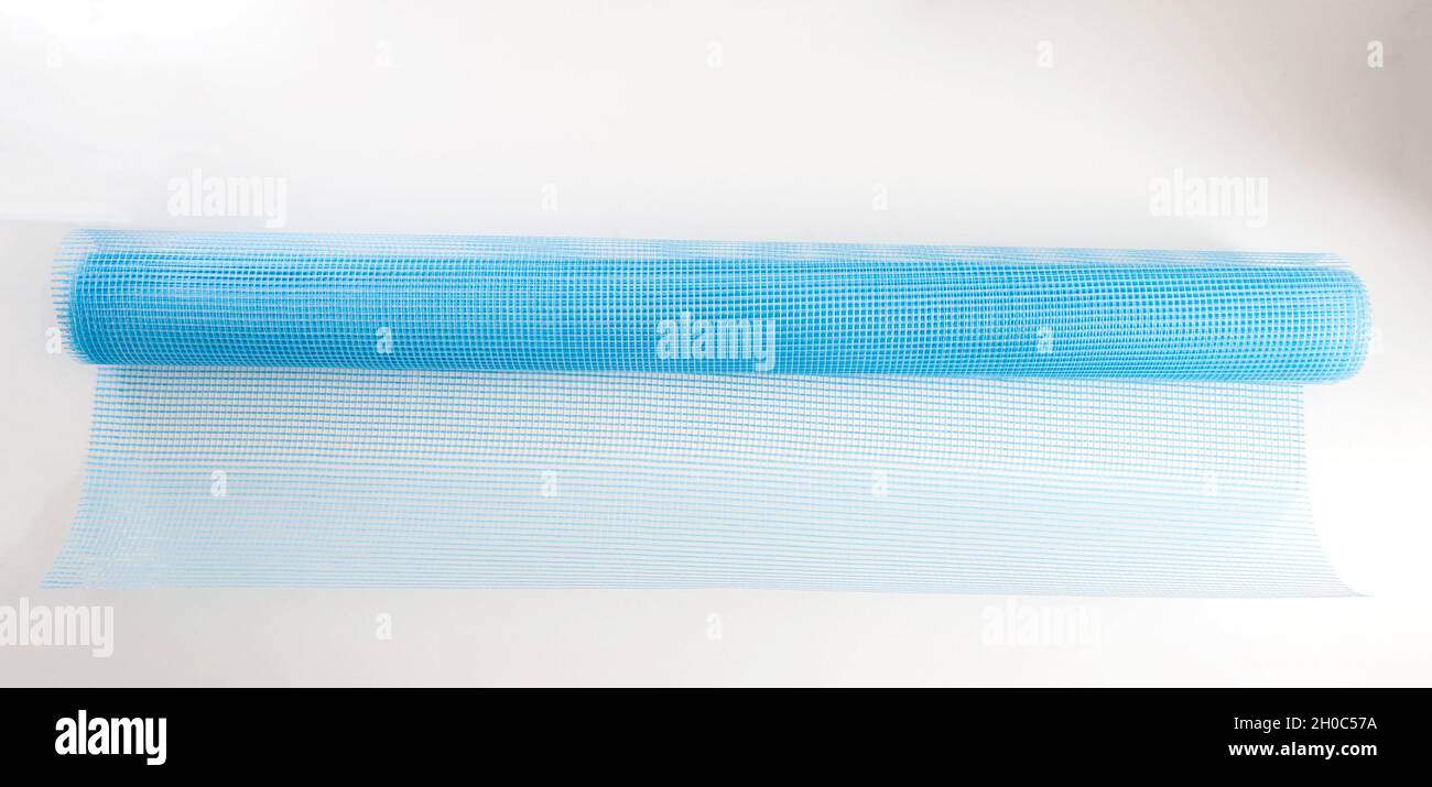 Blue reinforcing construction mesh for wall strengthening on white ...