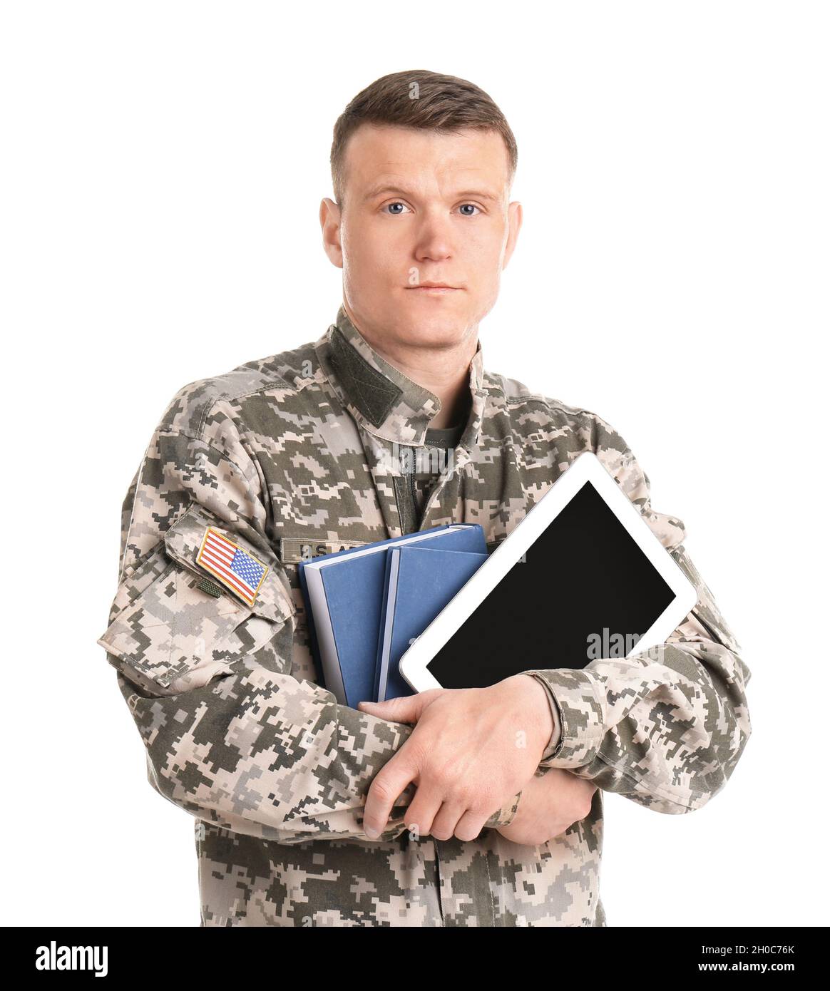 Male soldier with books and tablet computer on white background ...