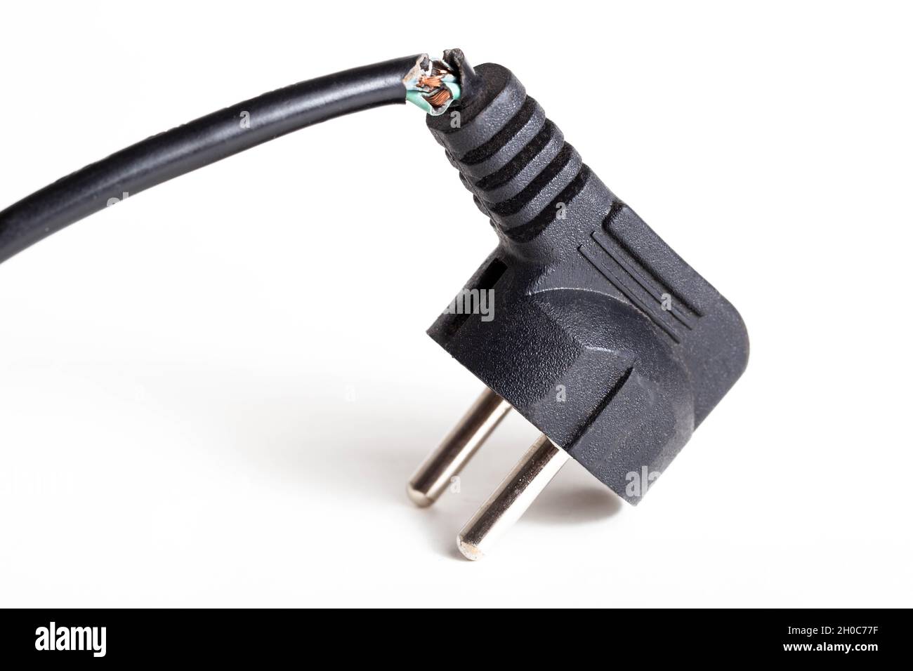 Broken electrical wire with a plug on a white background, isolate ...