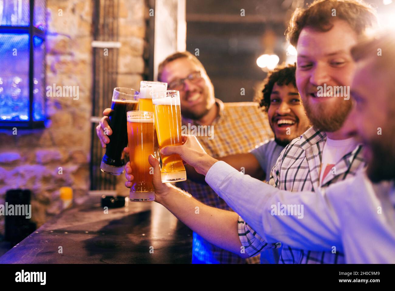 Four guy friends standing hi-res stock photography and images - Alamy