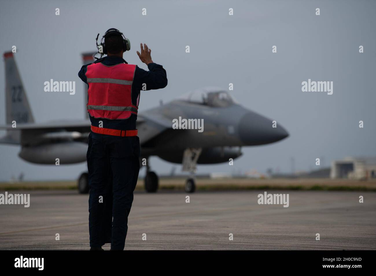 Senior Airman Juston Forde, directs a F-15C to its correct position for ...