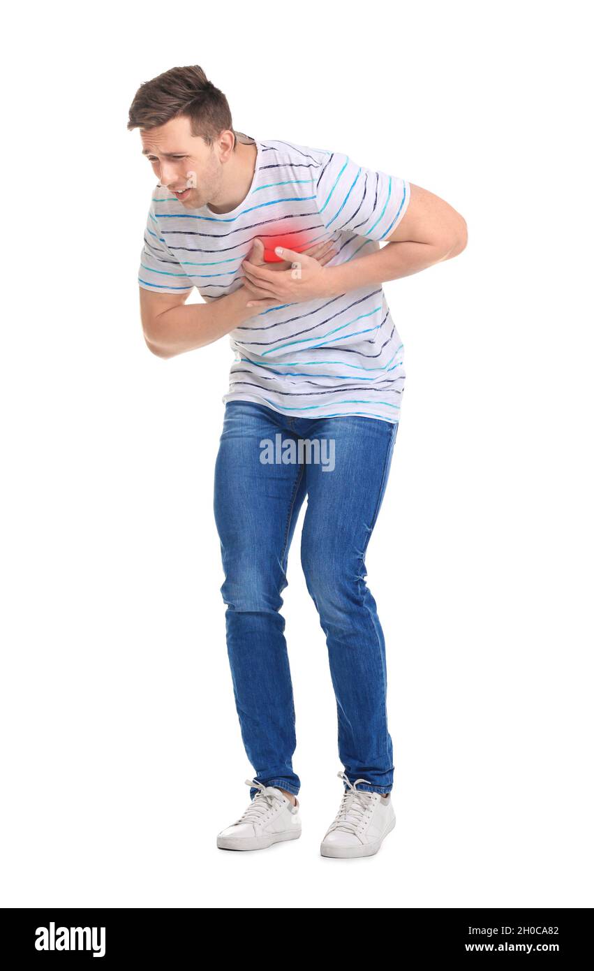 Young man having heart attack on white background Stock Photo - Alamy