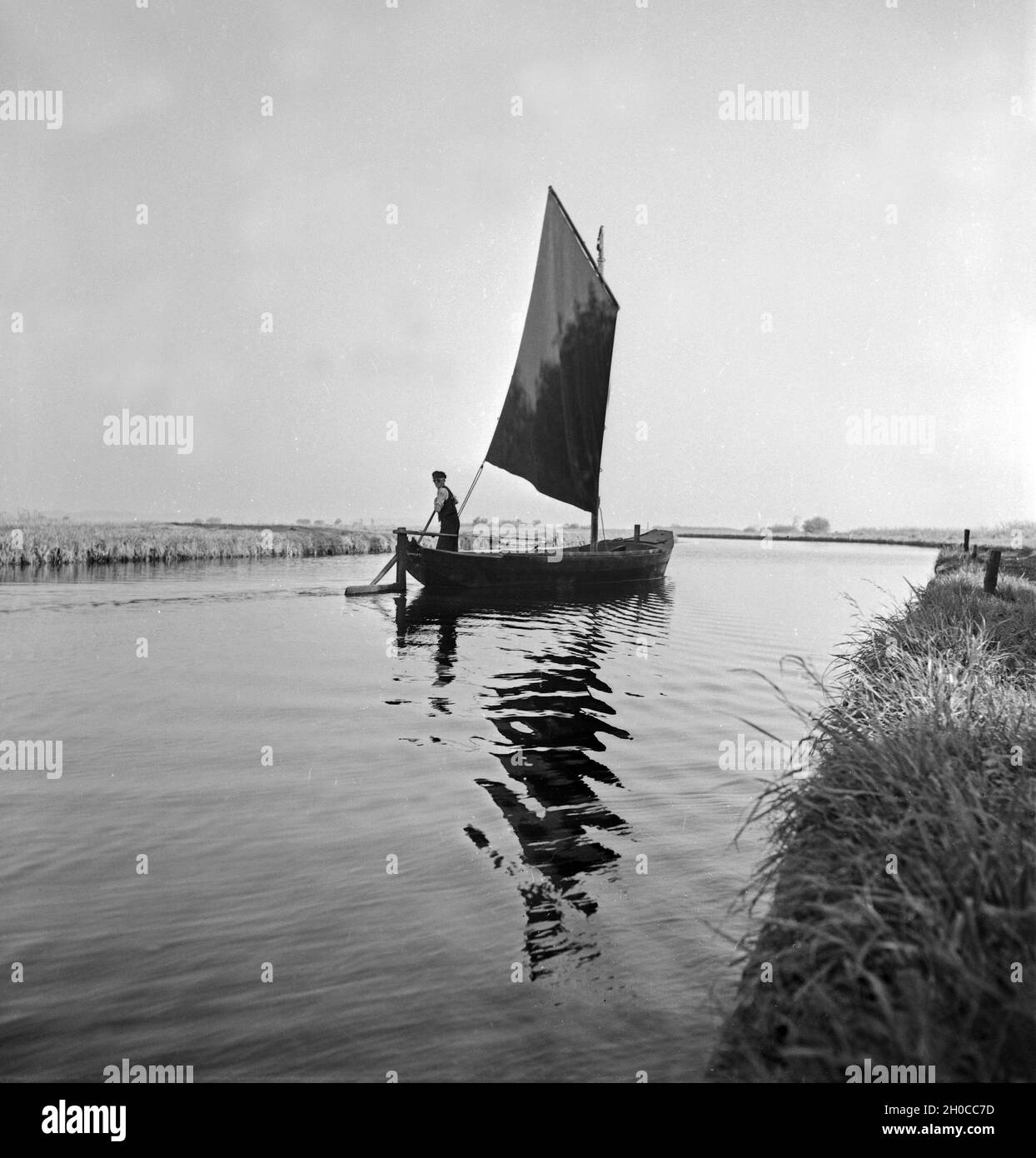 Man in little boat Black and White Stock Photos & Images - Alamy