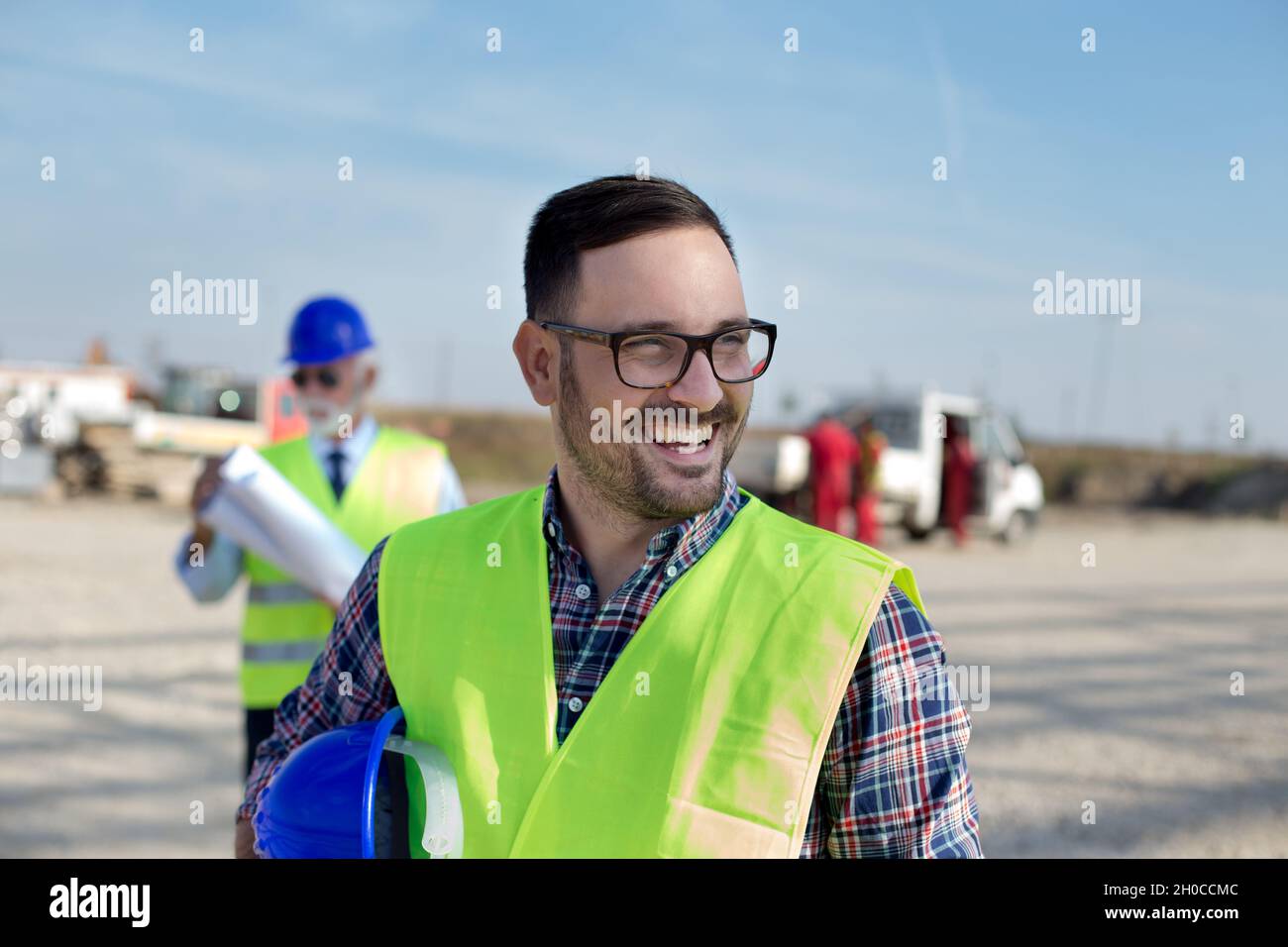 Young engineer holding helmet hi-res stock photography and images - Alamy