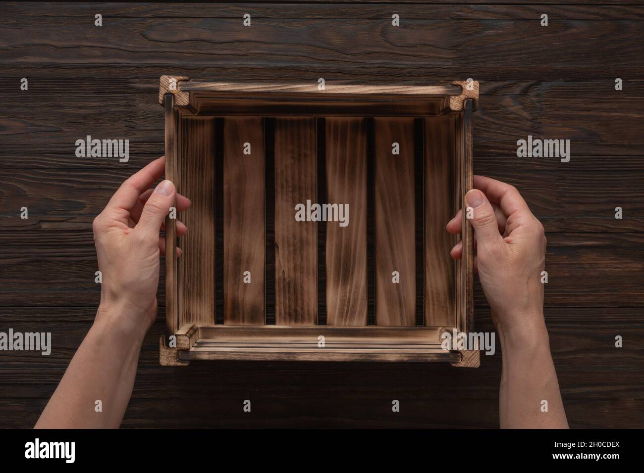 Female hands holding wooden box hi-res stock photography and images - Alamy