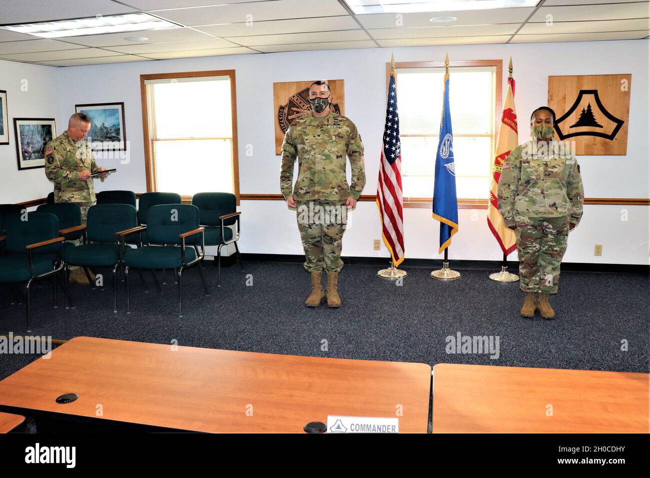 Fort McCoy Garrison Commander Col. Michael D. Poss prepares to present ...