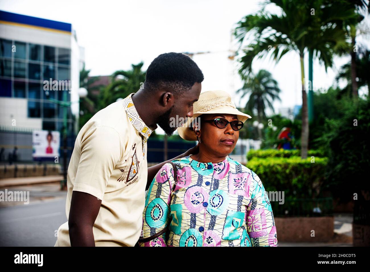 beautiful african couple standing and talking together outdoors in the ...