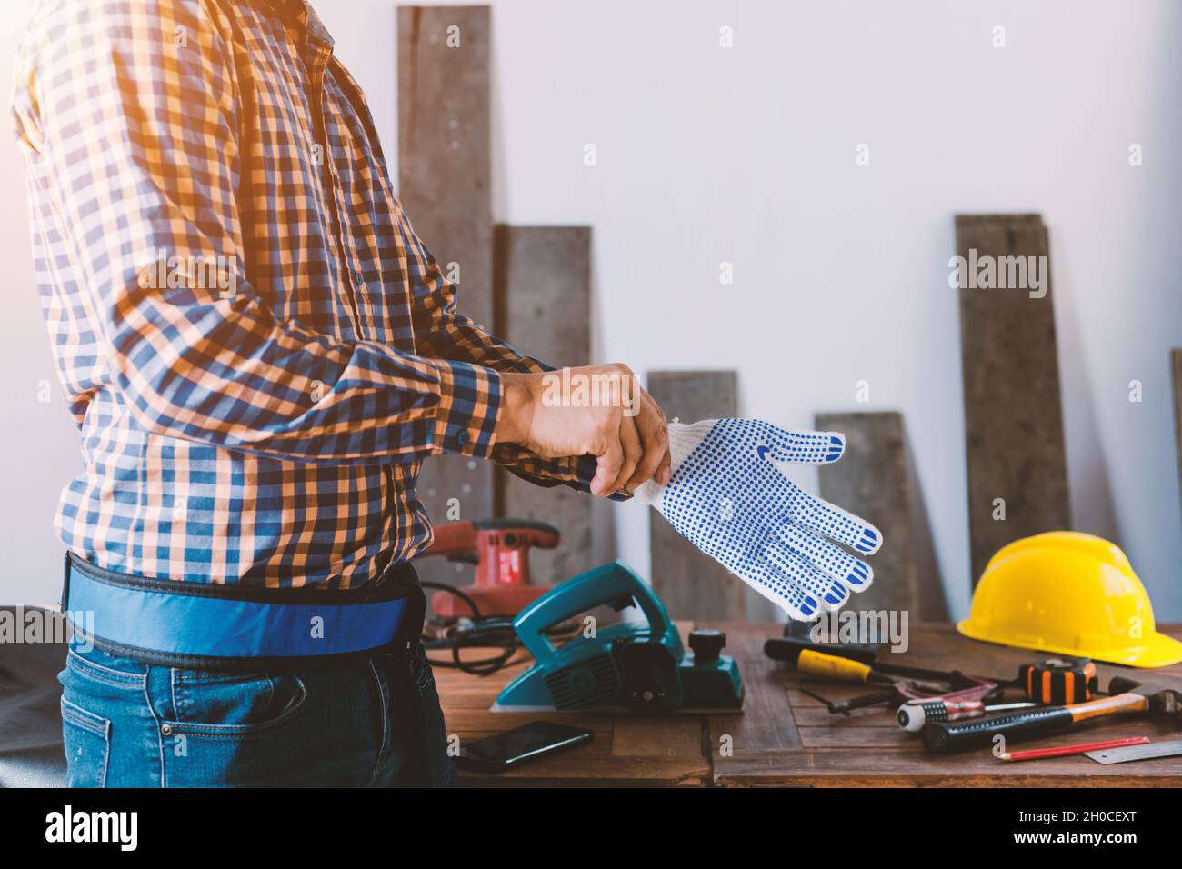 Carpenter working on woodworking machines in carpentry shop Stock Photo ...