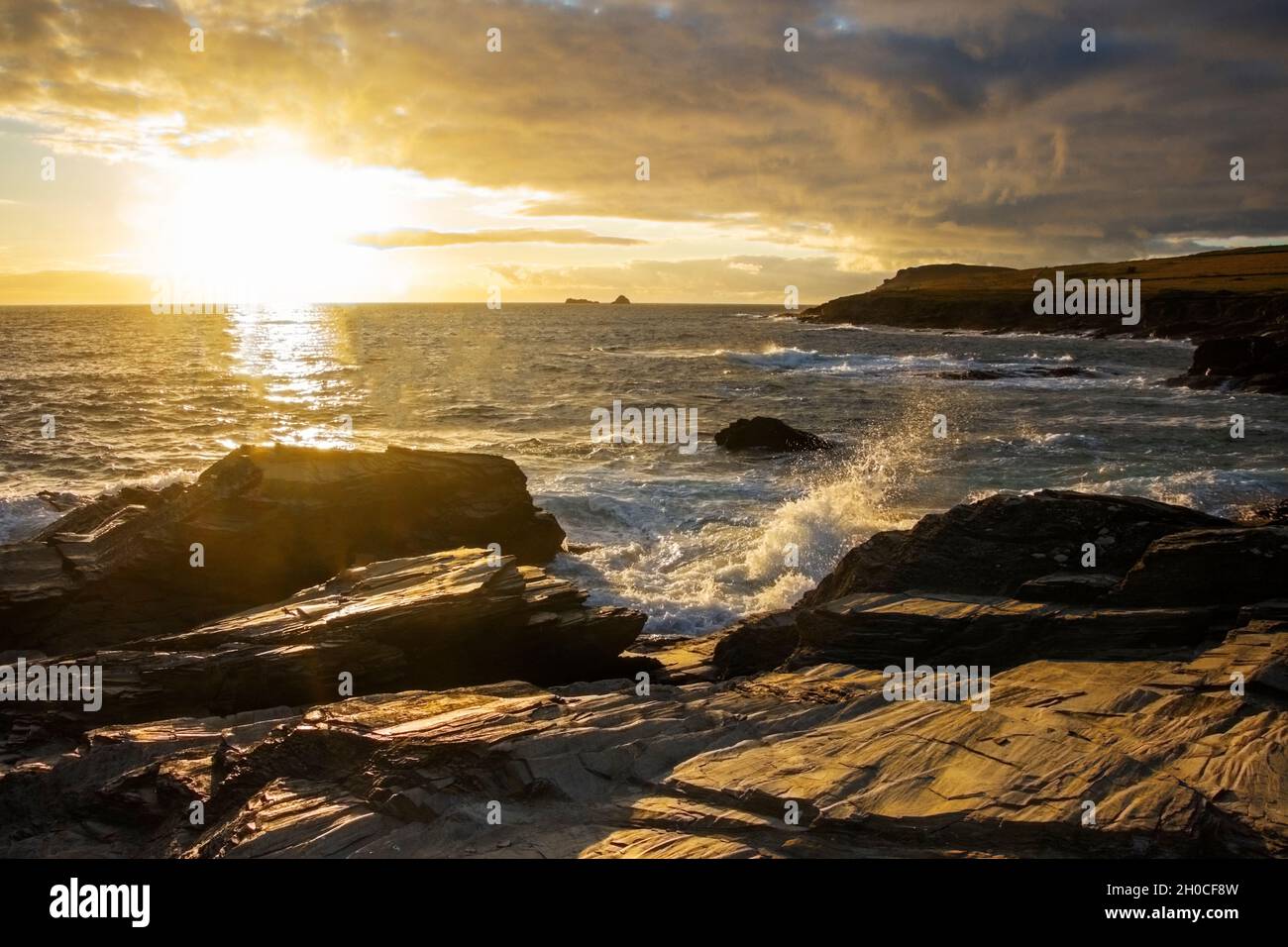 Constantine bay, Cornwall, England, UK as the golden sun sets over the ...