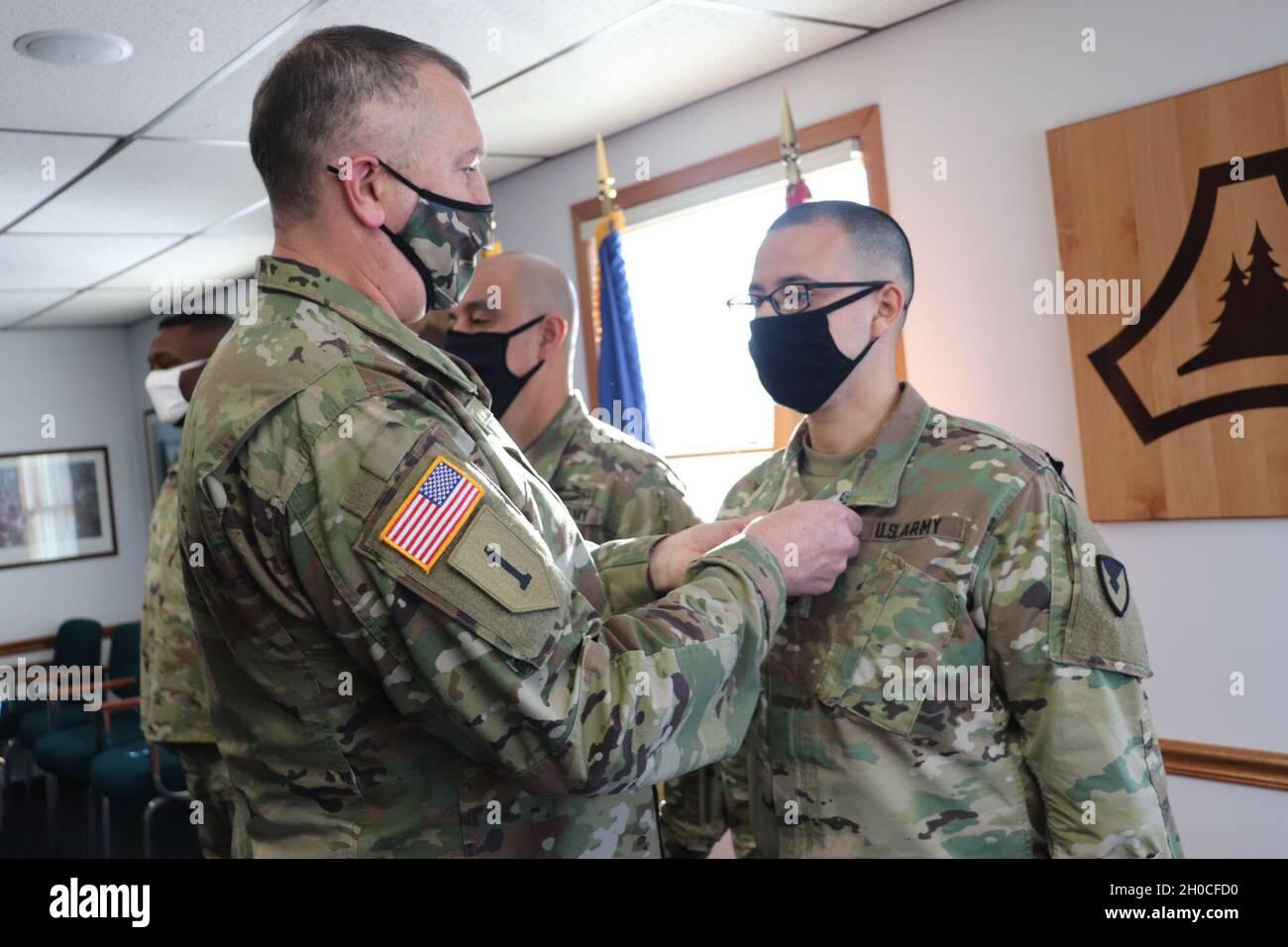 Garrison Commander Col. Michael D. Poss presents the Military ...