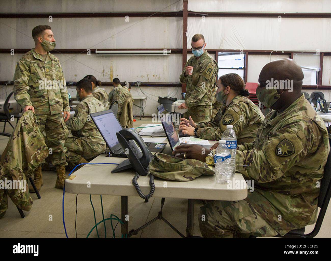 Army Major Raymond Nagley (far left) gives 50th Regional Support Group ...