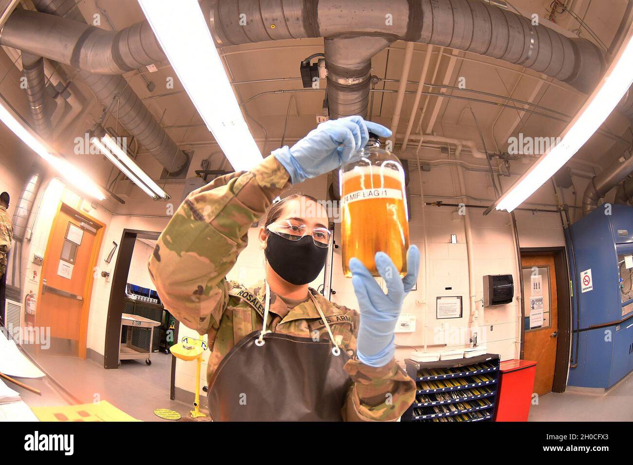 Army Pvt. Janeth Rosales conducts a visual inspection of fuel for ...