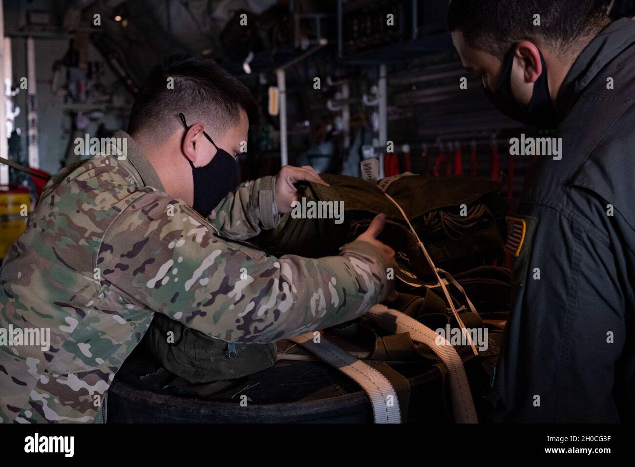 Staff Sgt. Jay Tuazon, left, and Tech. Sgt. Brian Gates, 36th Airlift ...