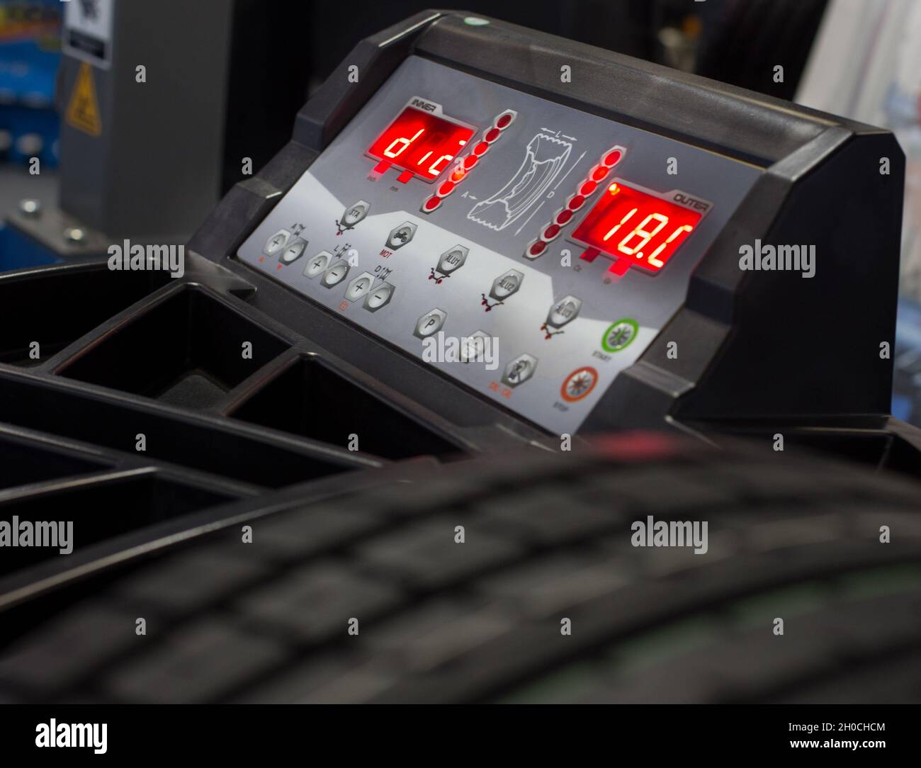 Modern device for wheel balancing with display Stock Photo - Alamy