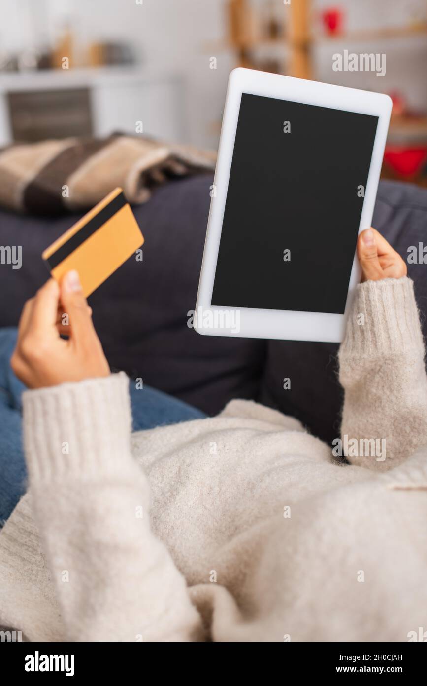 Cropped view of african american woman holding digital tablet with ...