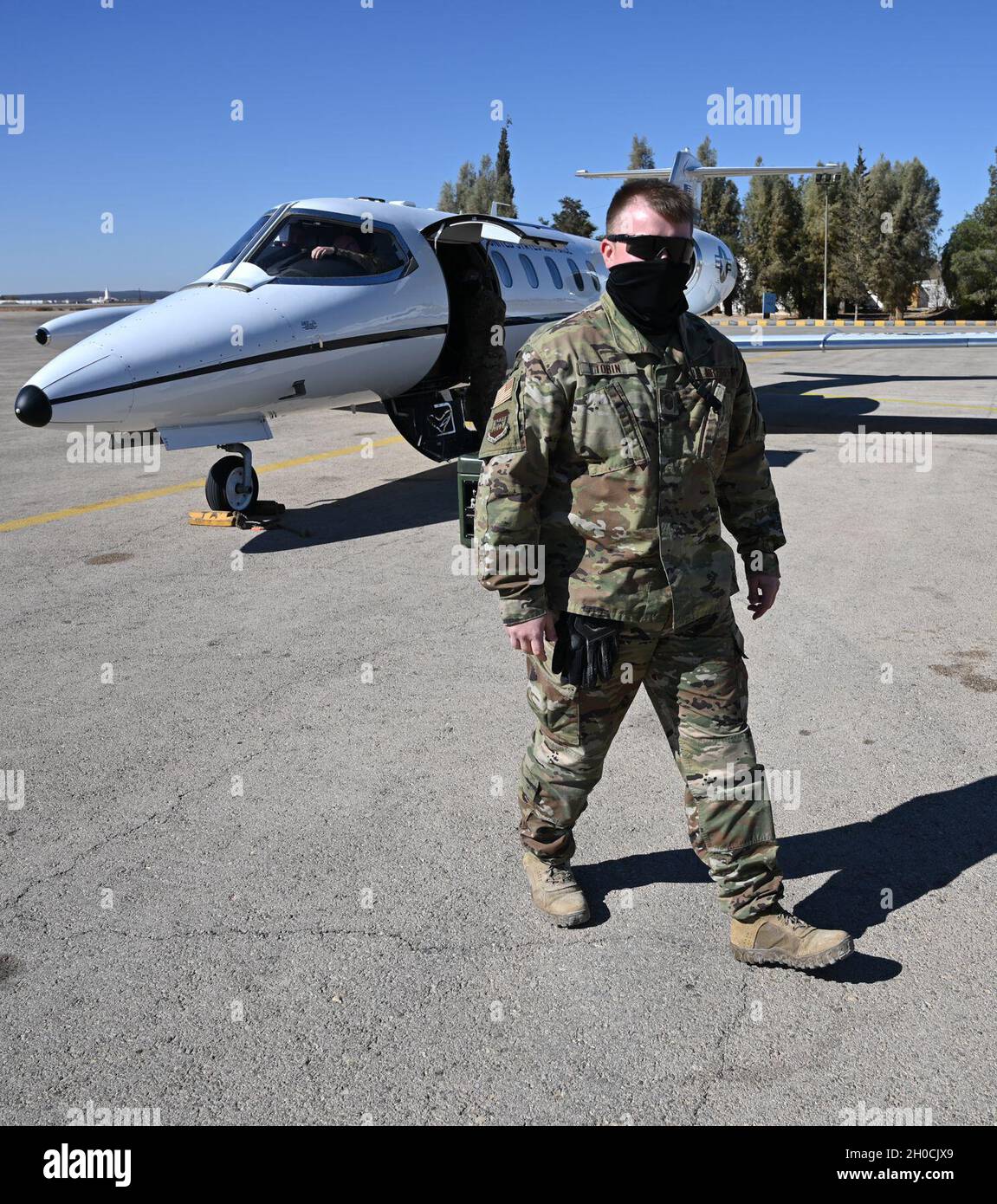 U.S. Air Force U.S. Air Force Master Sgt. Colin Tobin helps secure the ...