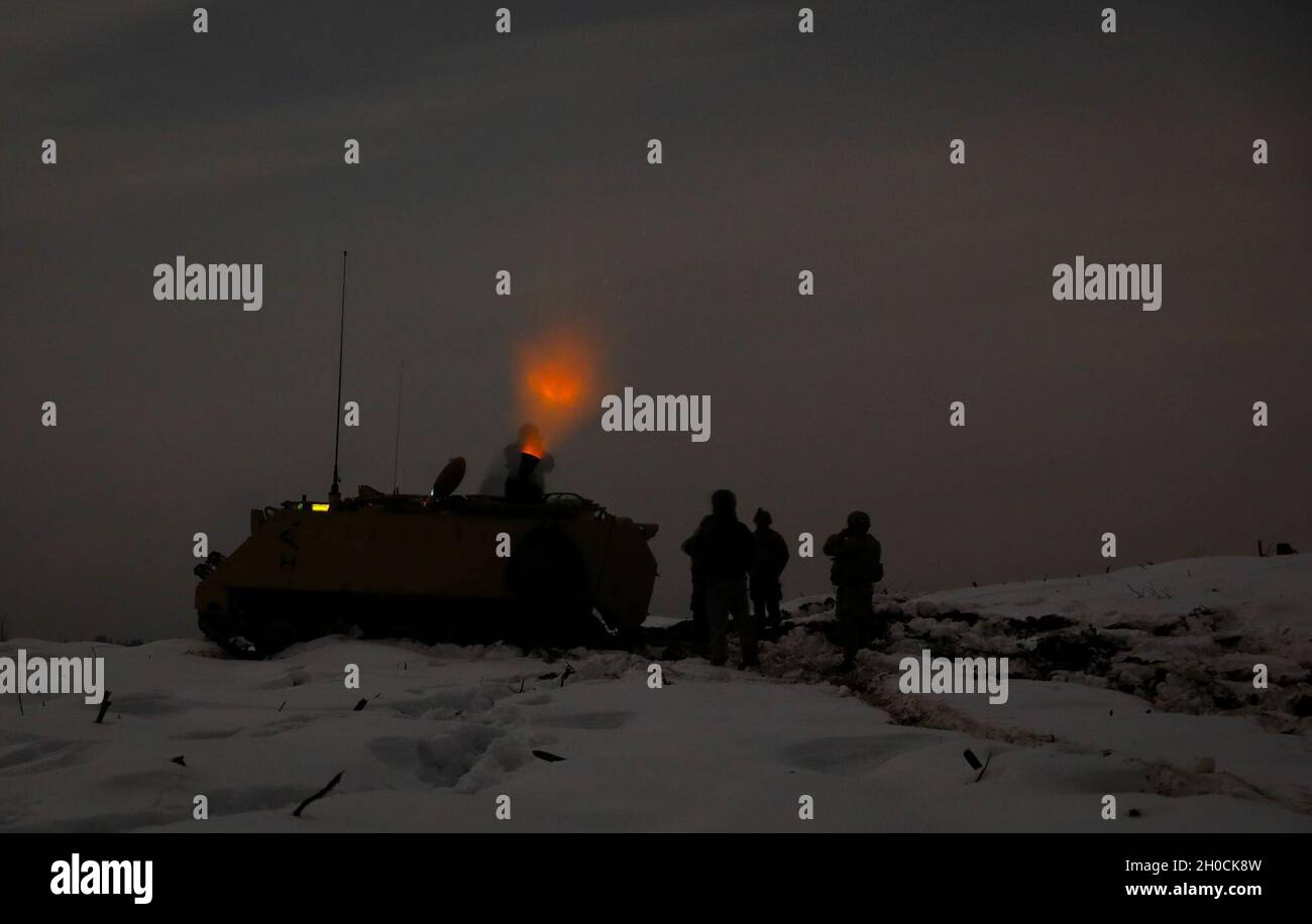 Lithuanian and U.S. mortarmen fire mortars at night Jan. 23, 2021, at ...