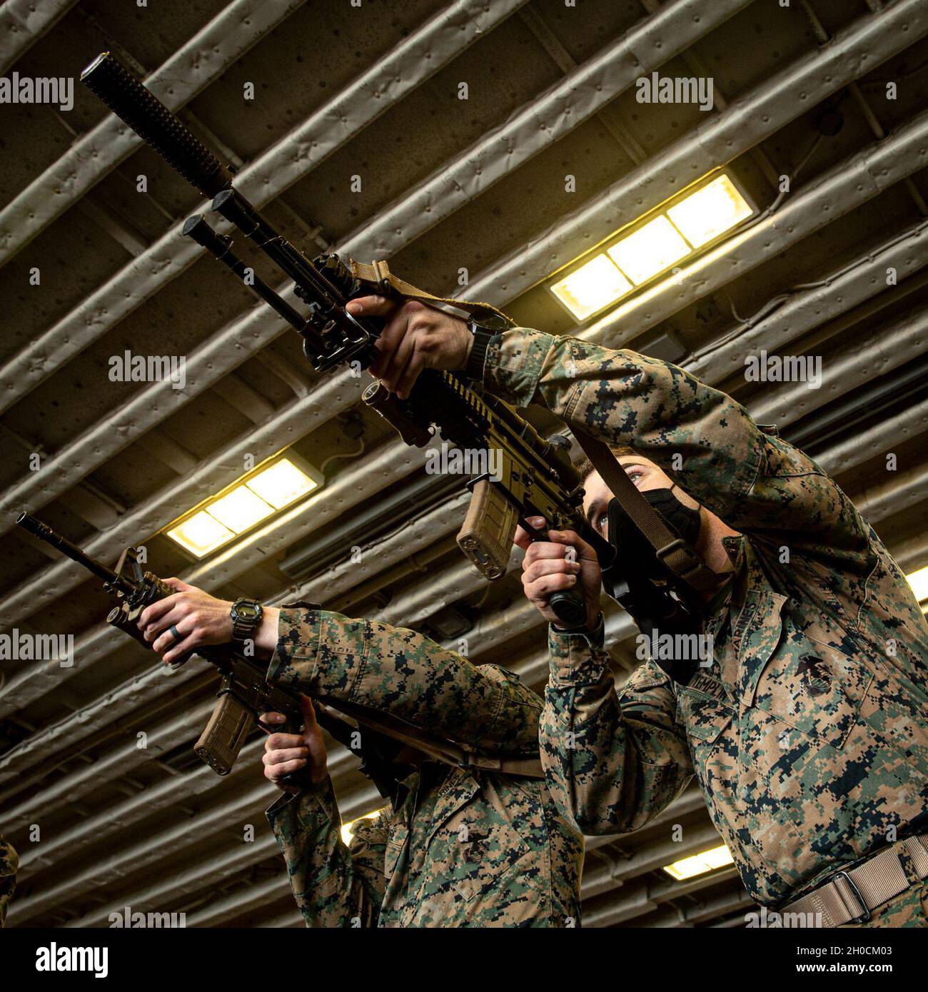 U.S. Marine Lance Cpl. J Templin, right, a designated marksman and a ...