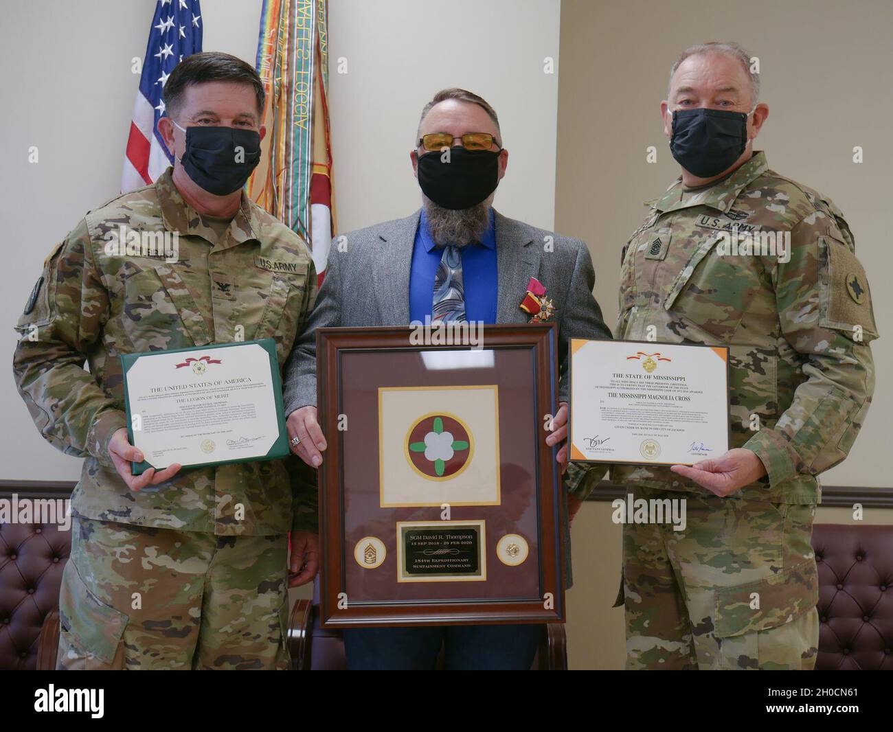 Sgt. Maj. David Thompson, retired, stands with Col. Jonathan "Scott ...