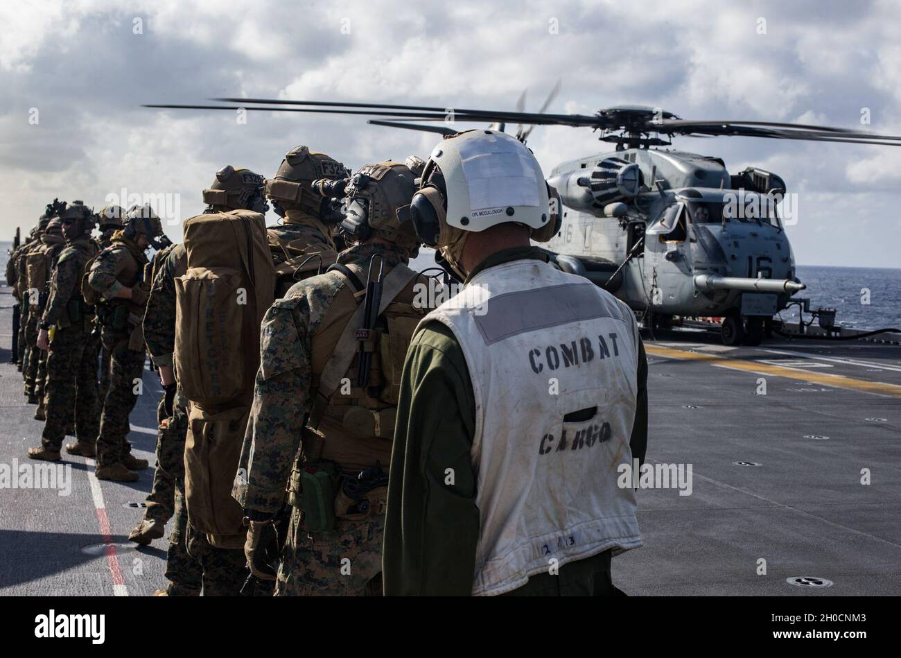 U.S. Marines with 31st Marine Expeditionary Unit (MEU) load onto a CH ...