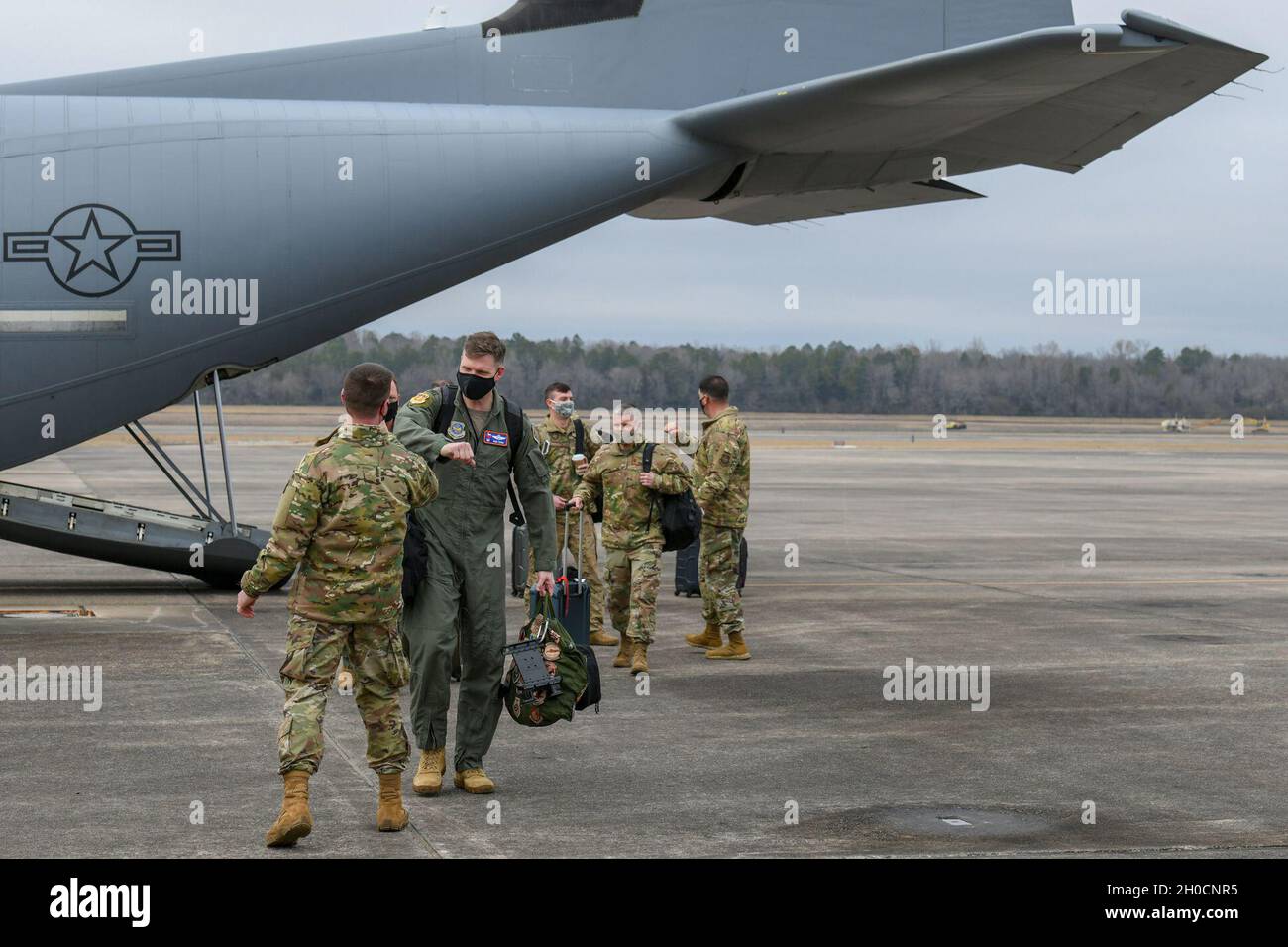 Col. Will Clark, 19th Airlift Wing vice commander, left, greets Col. Clint Wilson, 317th ...