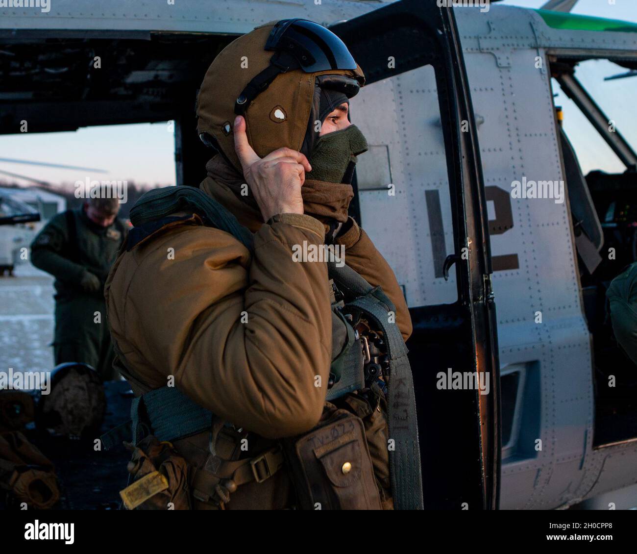 Lance Cpl. Lake M. Keating, a UH-1Y Huey crew chief, puts on his ...