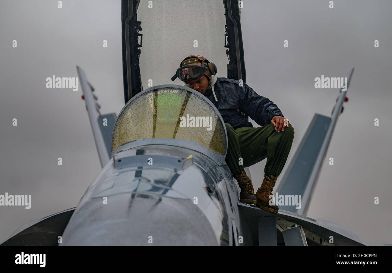 U.S. Navy Airman Chas White, plane captain assigned to Electronic ...