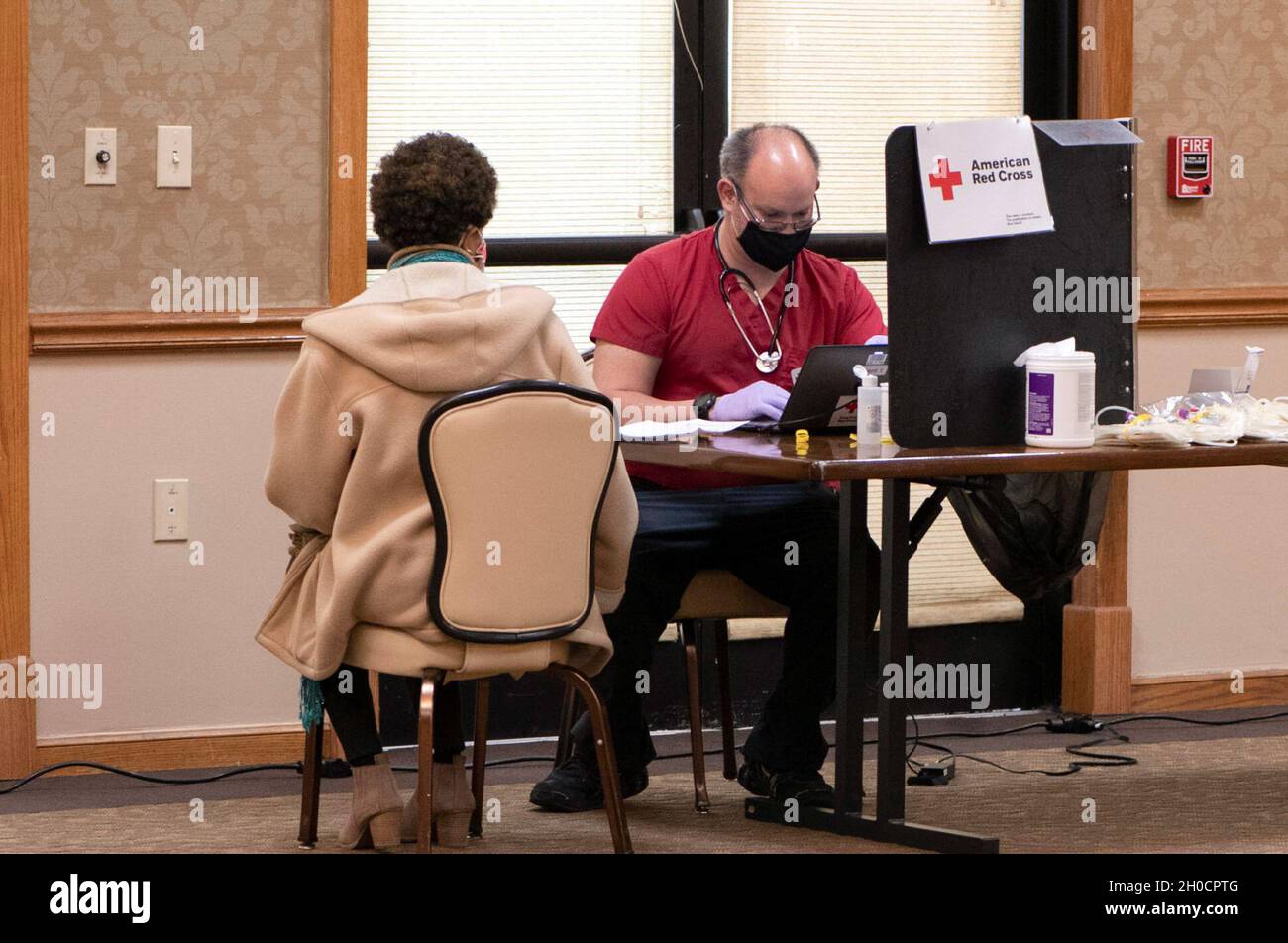 David Beale, a volunteer with American Red Cross takes a donors ...