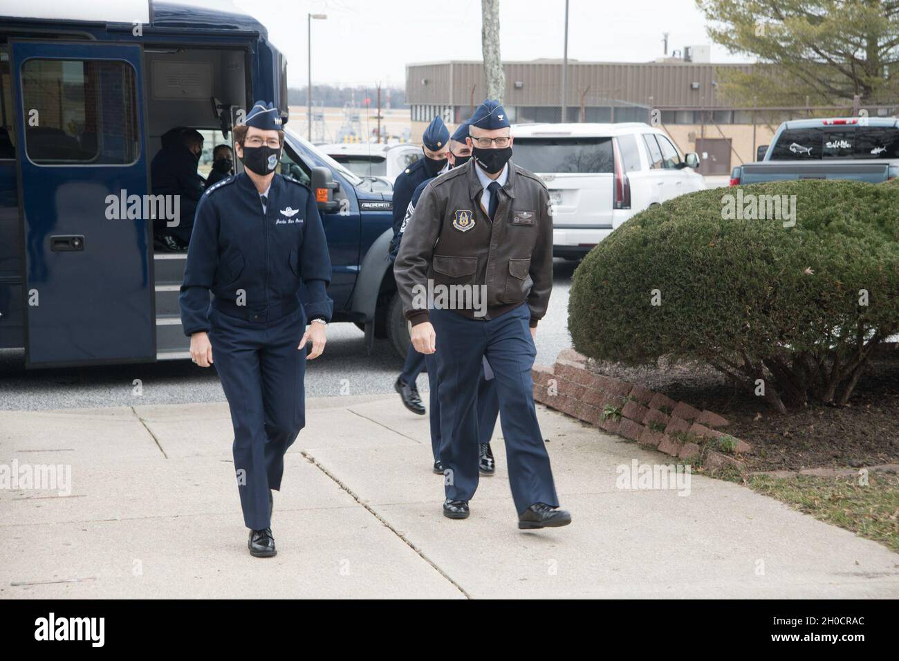 Gen. Jacqueline Van Ovost, Air Mobility Command commander, is escorted ...