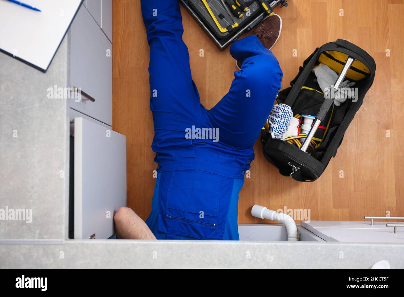 Professional plumber with set of tools working indoors, top view Stock ...