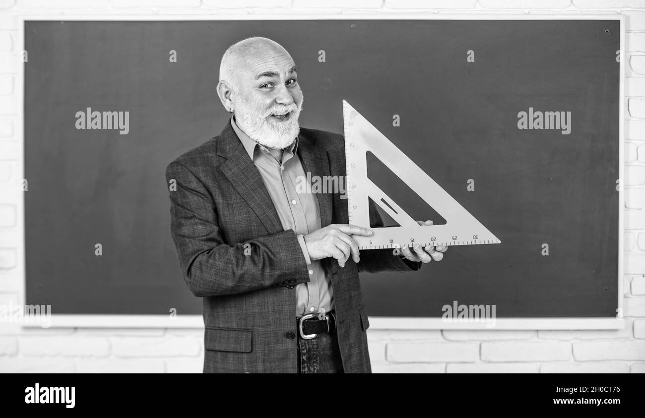 Understanding. bearded tutor man at blackboard. back to school. Math ...