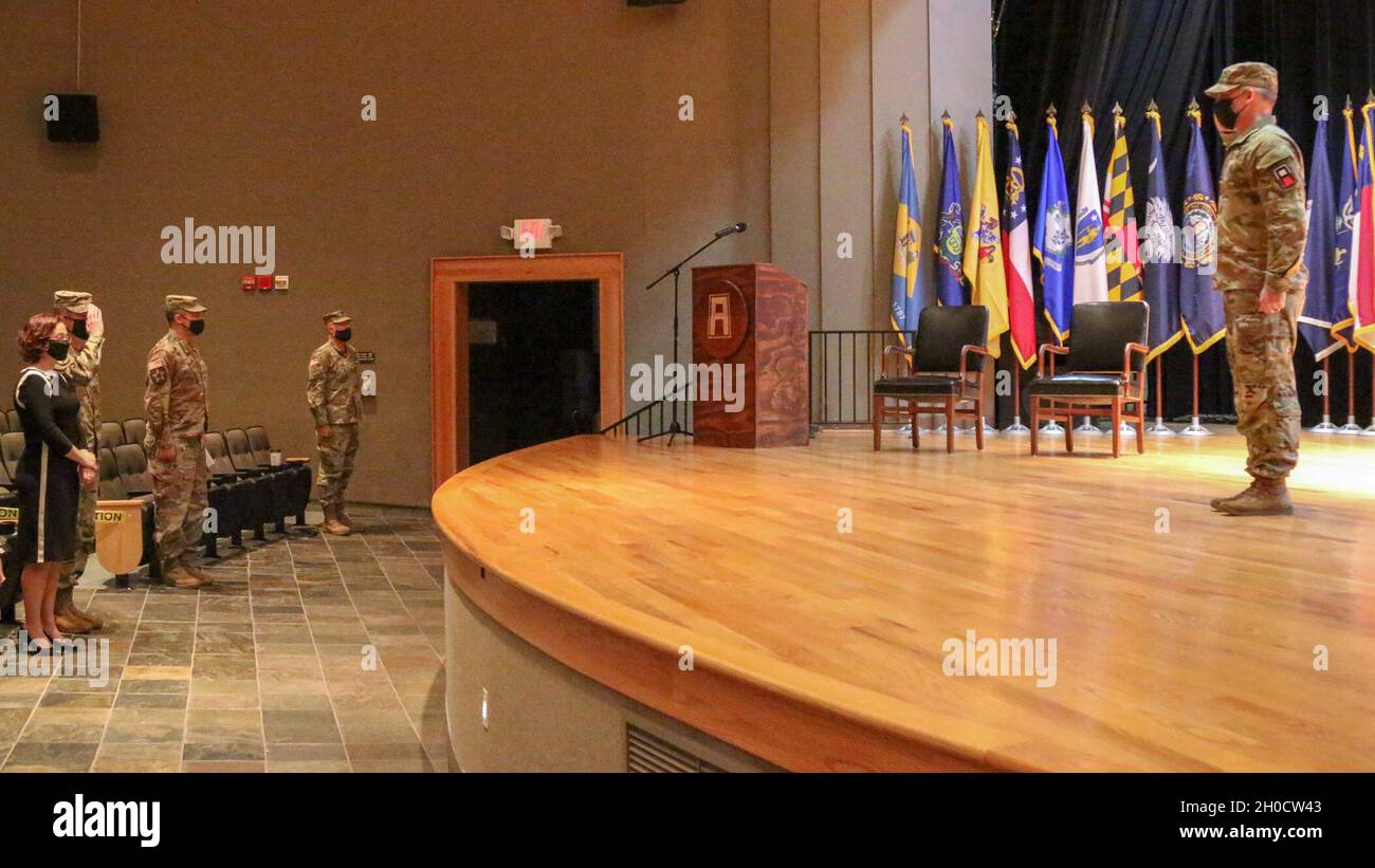 Command Sgt. Maj. Raymond J. Ramirez, accepts the colors from Col ...