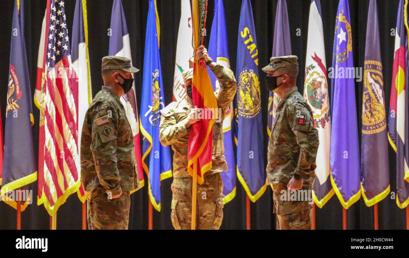 Command Sgt. Maj. Raymond J. Ramirez, accepts the colors from Col ...