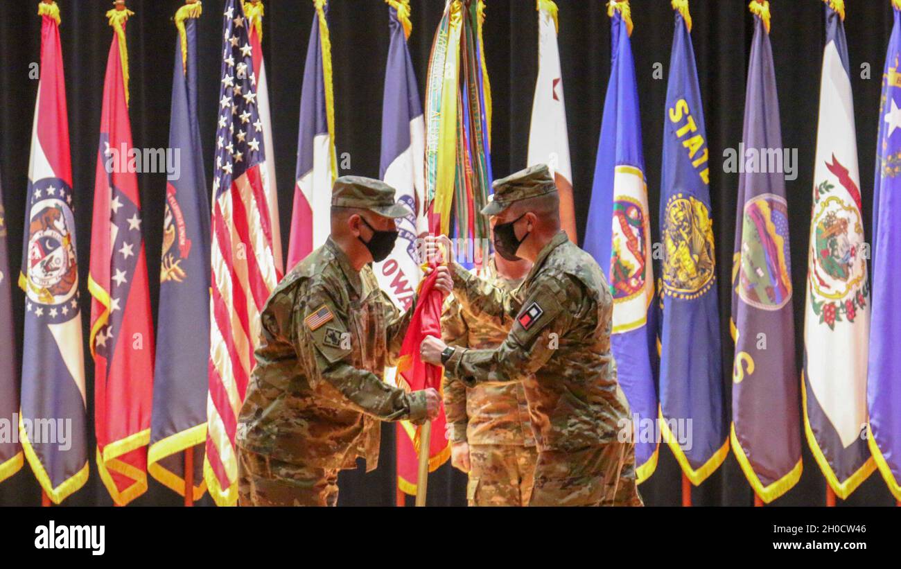 Command Sgt. Maj. Raymond J. Ramirez, accepts the colors from Col ...