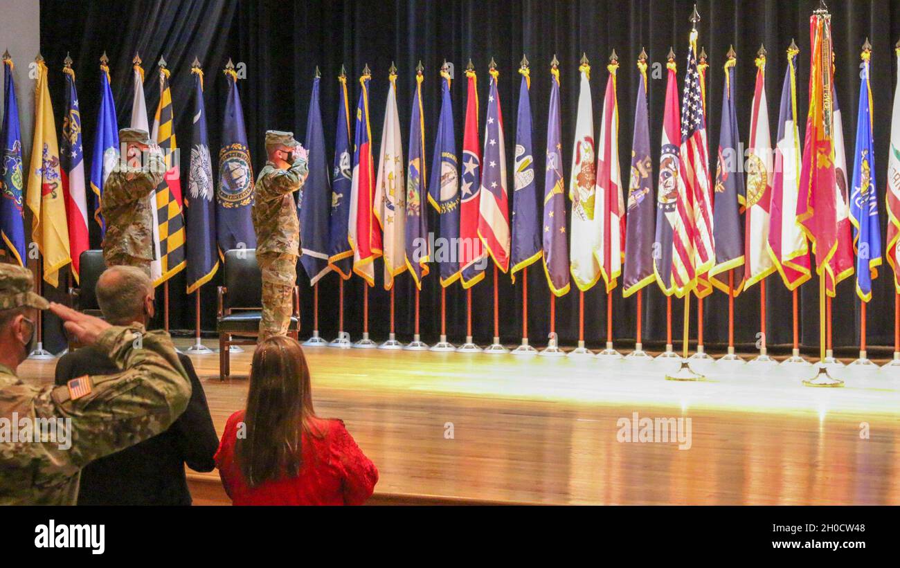 Command Sgt. Maj. Raymond J. Ramirez, accepts the colors from Col ...