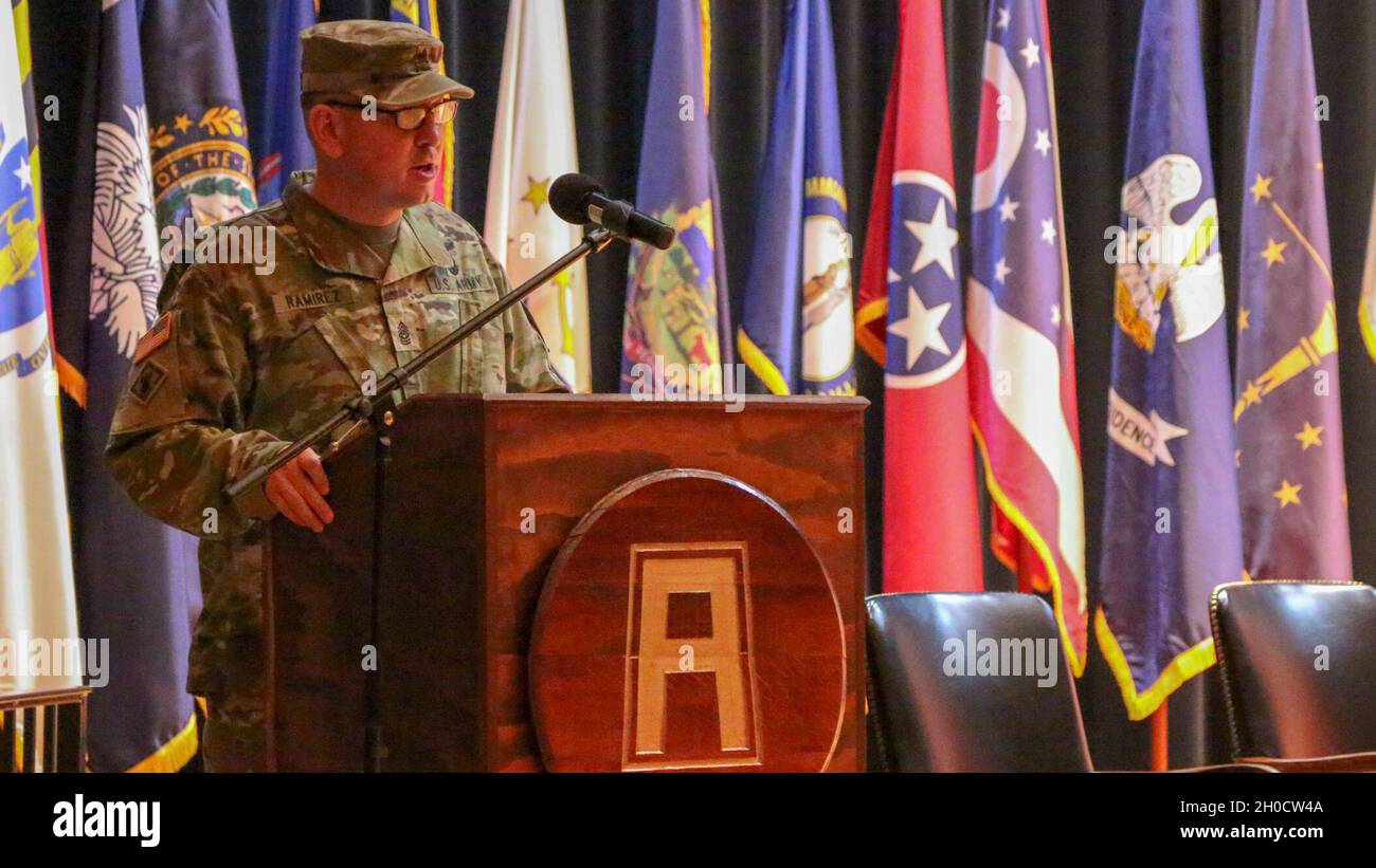 Command Sgt. Maj. Raymond J. Ramirez, accepts the colors from Col ...