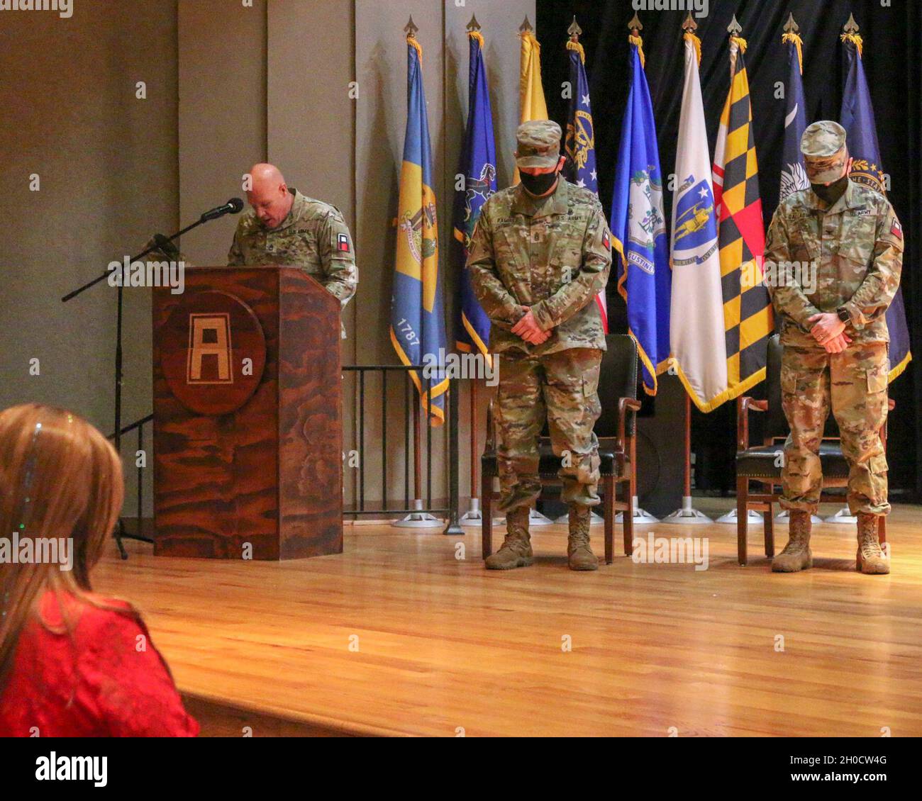 Command Sgt. Maj. Raymond J. Ramirez, accepts the colors from Col ...
