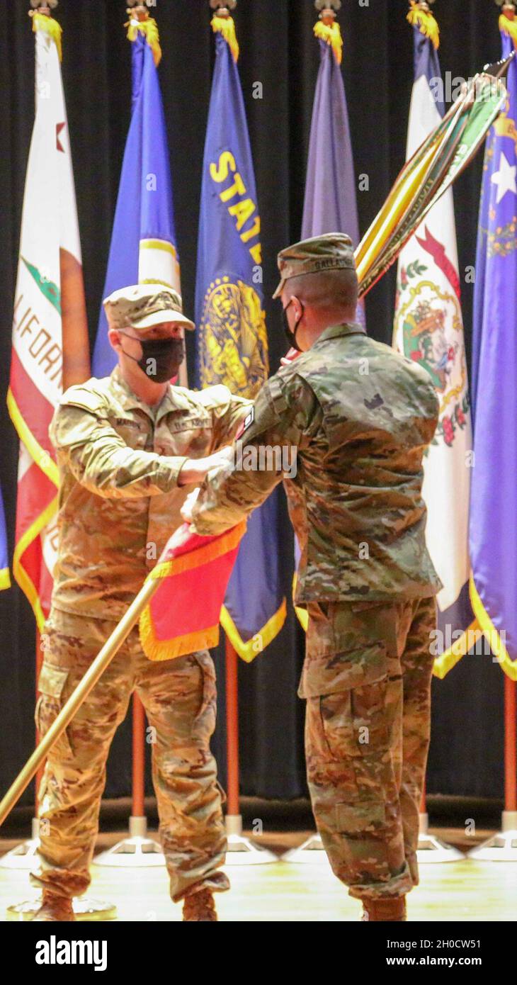 Command Sgt. Maj. Raymond J. Ramirez, accepts the colors from Col ...