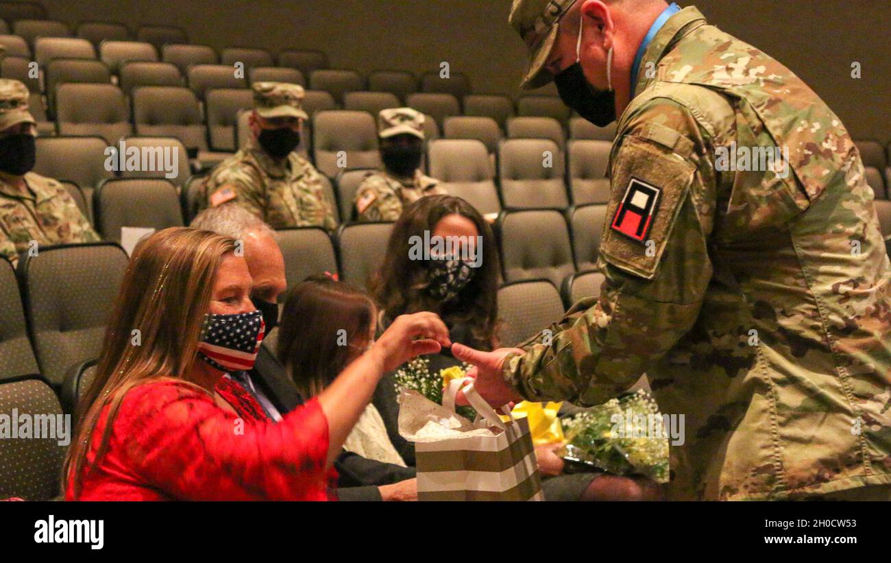 Command Sgt. Maj. Raymond J. Ramirez, accepts the colors from Col ...