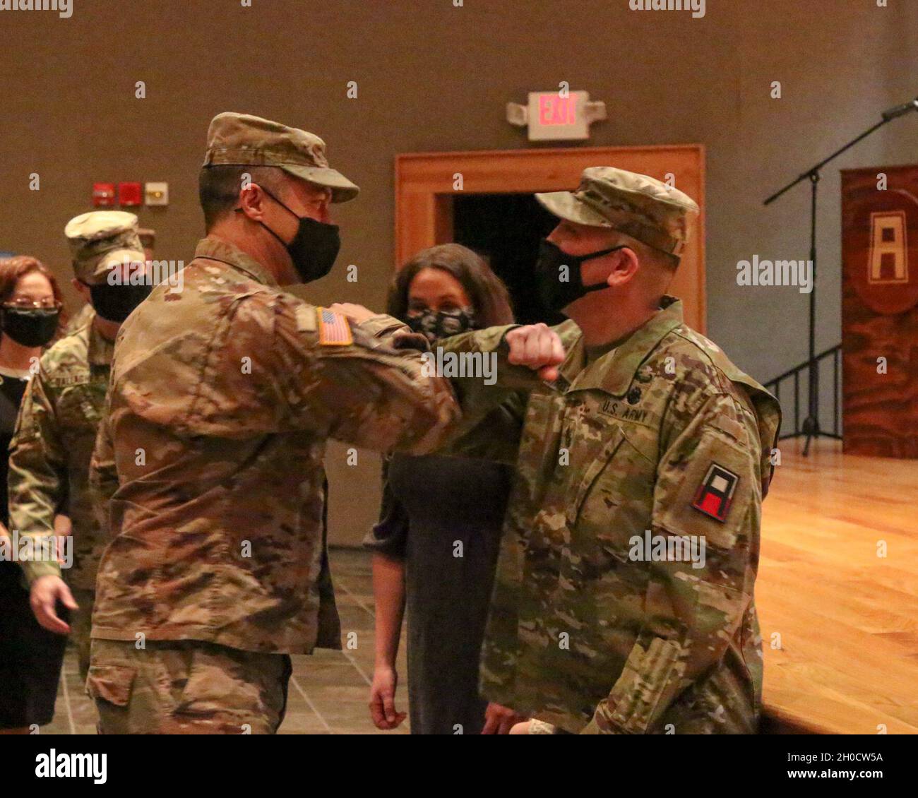 Command Sgt. Maj. Raymond J. Ramirez, accepts the colors from Col ...