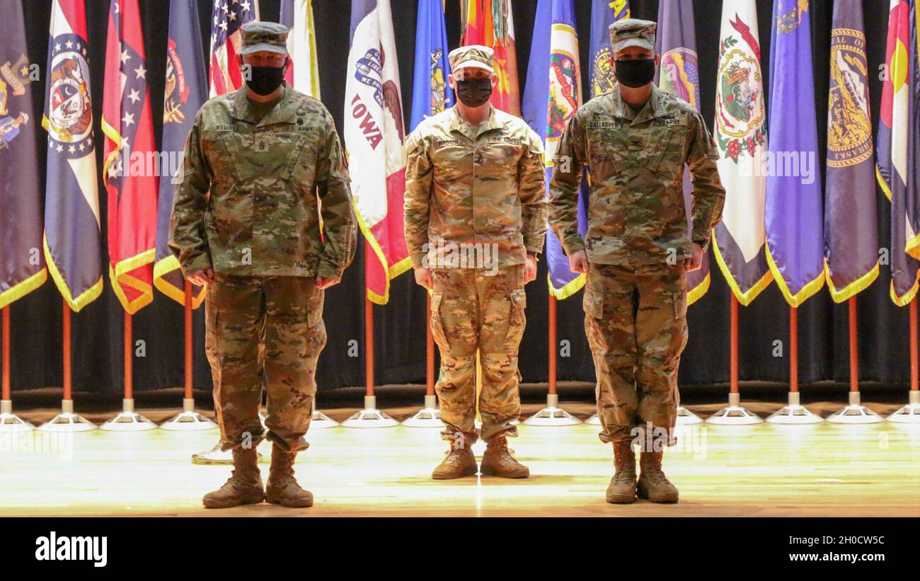 Command Sgt. Maj. Raymond J. Ramirez, accepts the colors from Col ...