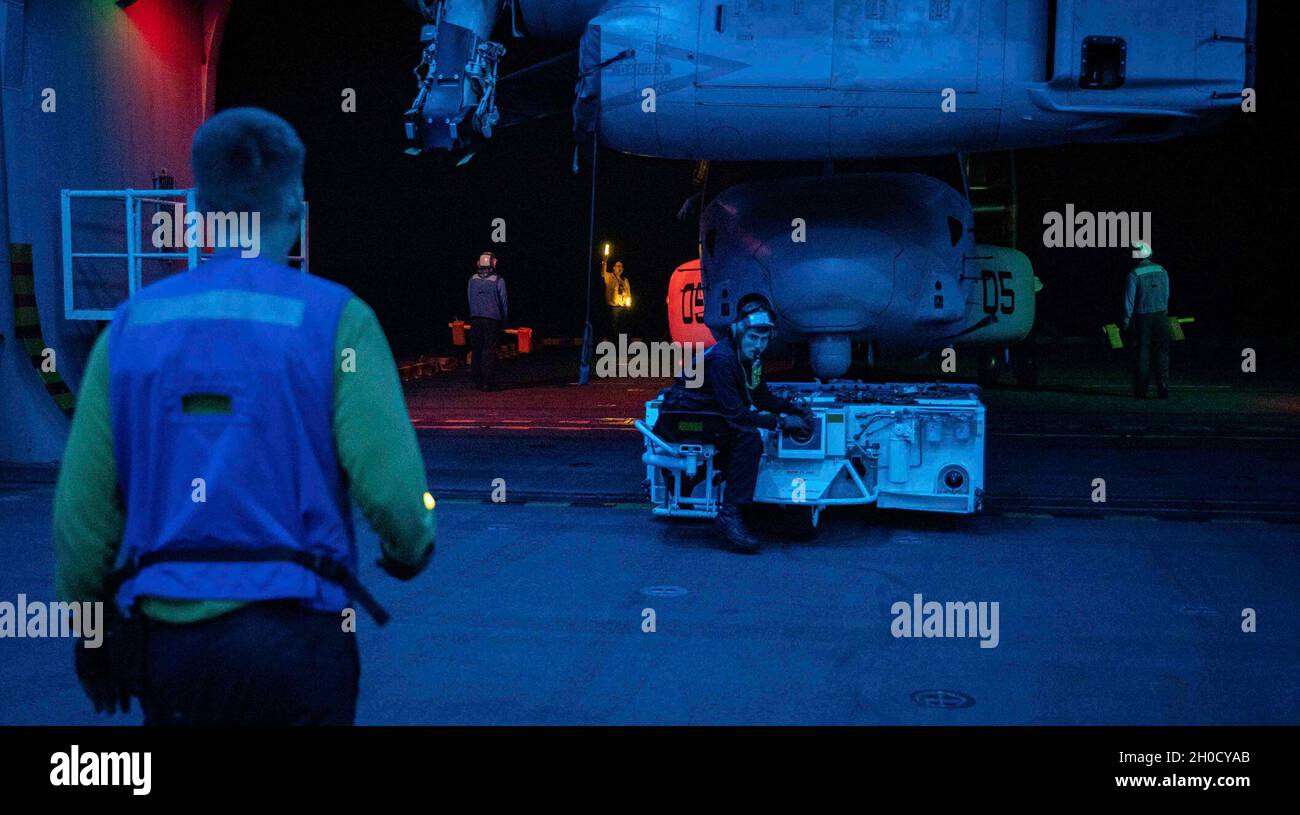 U.S. Sailors move a U.S. Marine Corps MV-22 Osprey assigned to Marine ...
