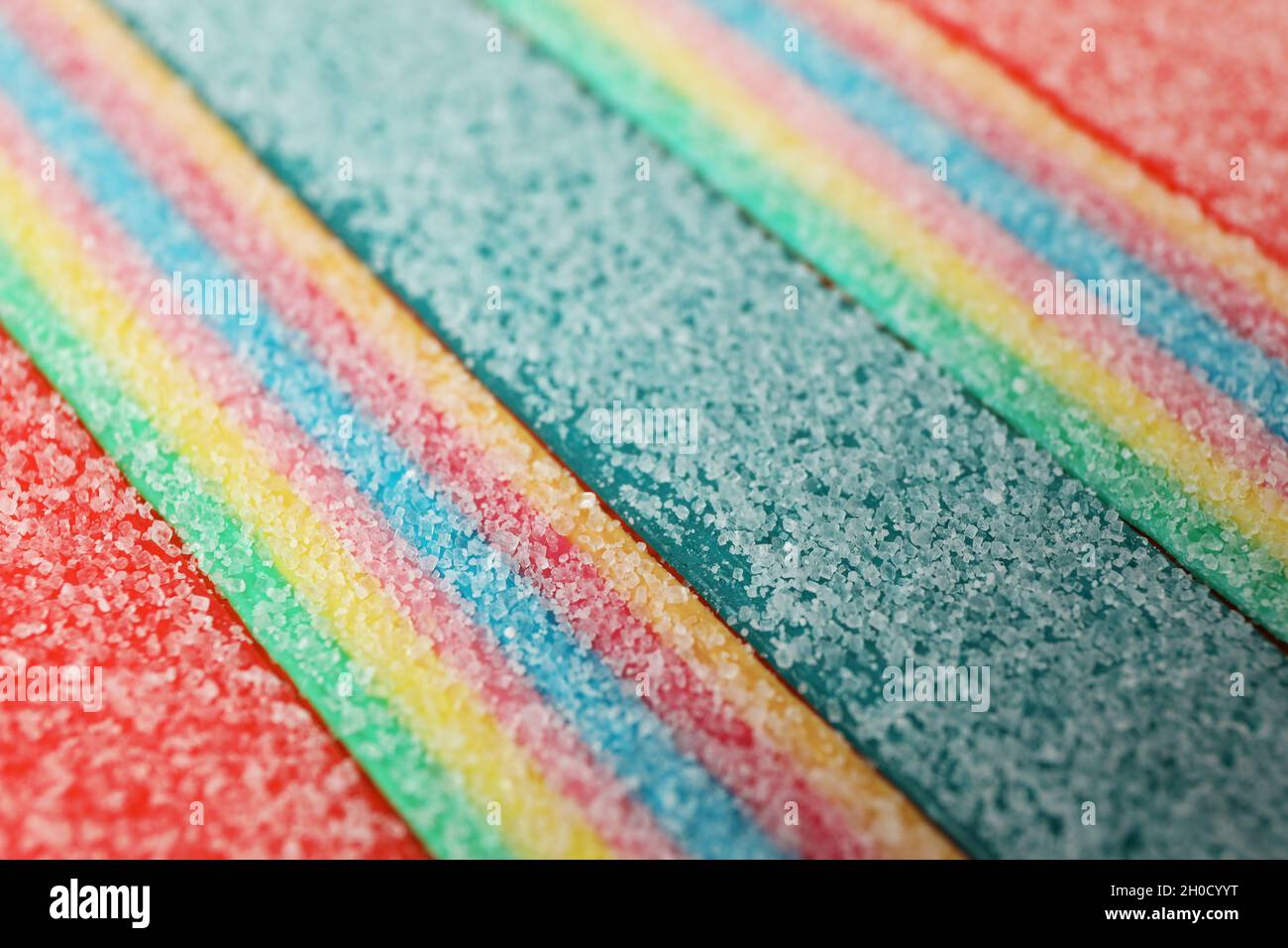 Gummy candies all over background, close up Stock Photo - Alamy