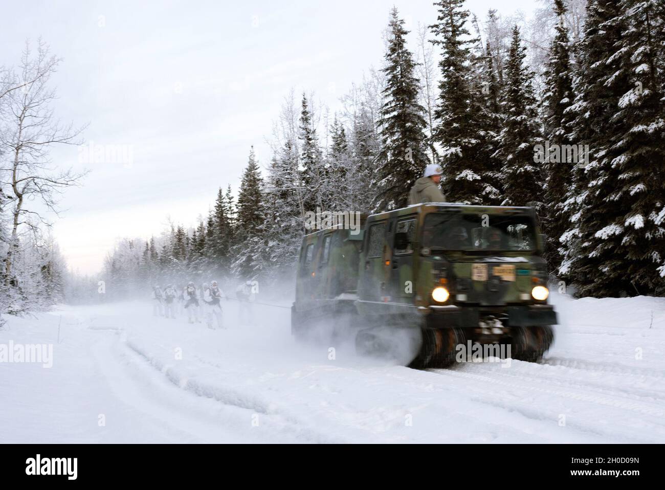An Army Small Unit Sustainment Vehicle pulls Army paratroopers assigned ...