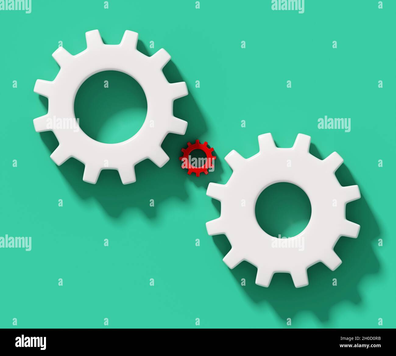 Small red cog between two big white cogs isolated on green background ...