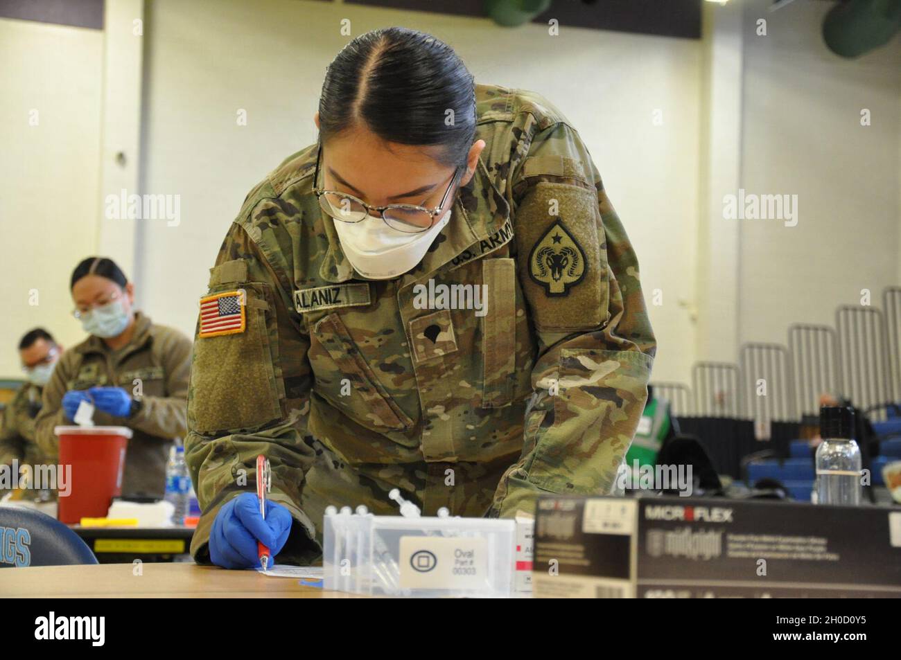 Spc. Dulce Alaniz with Joint Task Force 17 prepares patient paperwork ...