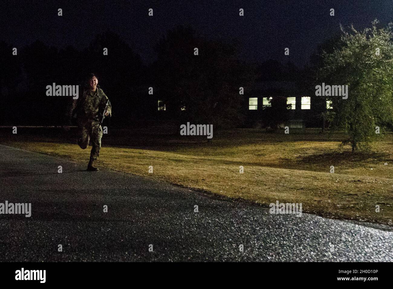 U.S. Army Pfc. Cody Watson, USARCENT, sprints with his ruck while ...