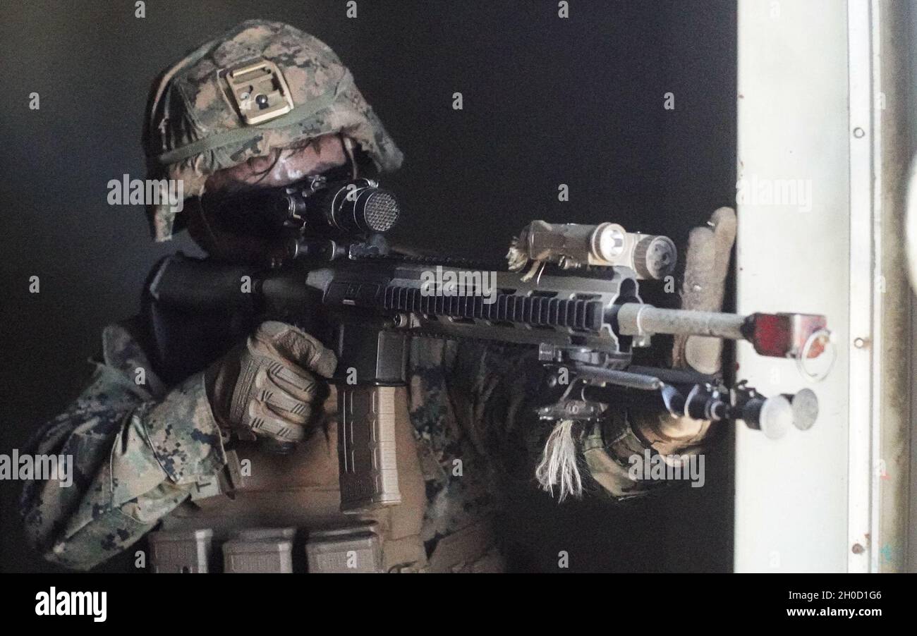 A U.S. Marine with Charlie Company, Battalion Landing Team (BLT) 1/1 ...