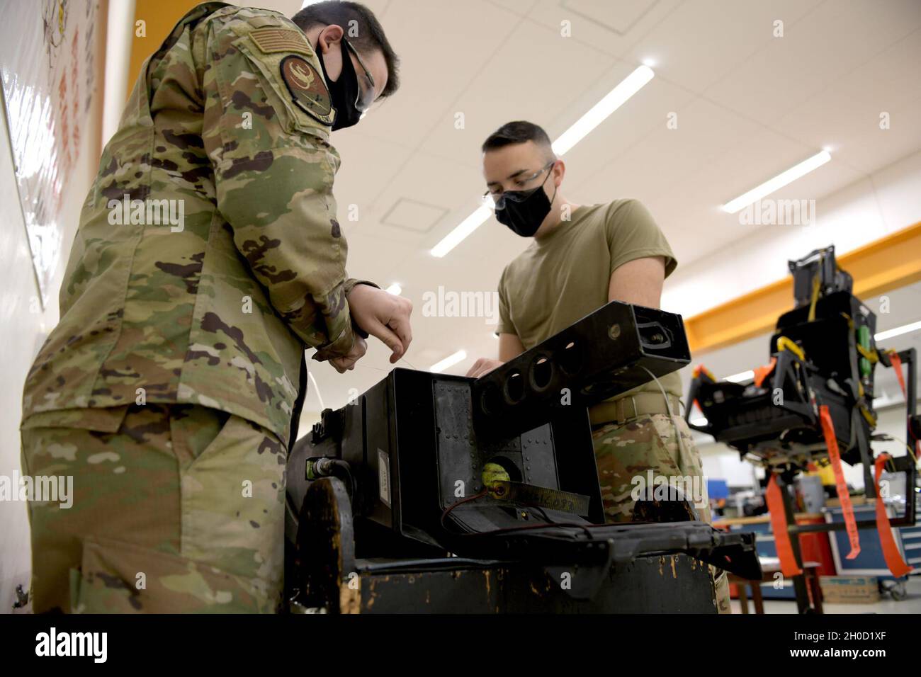 Airmen from the 18th Component Maintenance Squadron repair an ejection ...