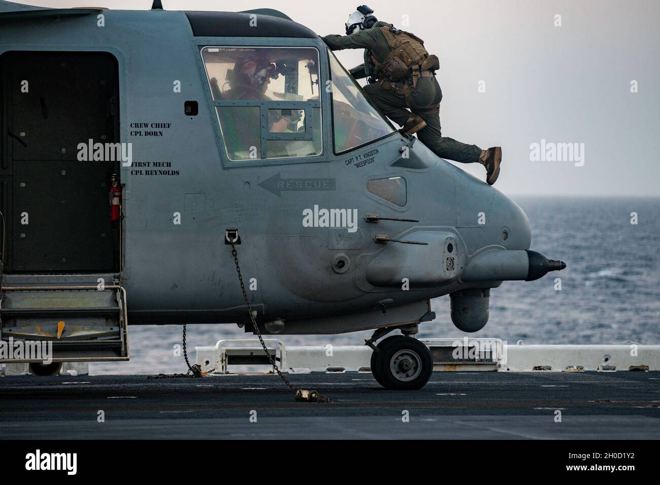 U.S. Marine Corps Pfc. Tomas Perea, an MV-22 Osprey crew chief with ...